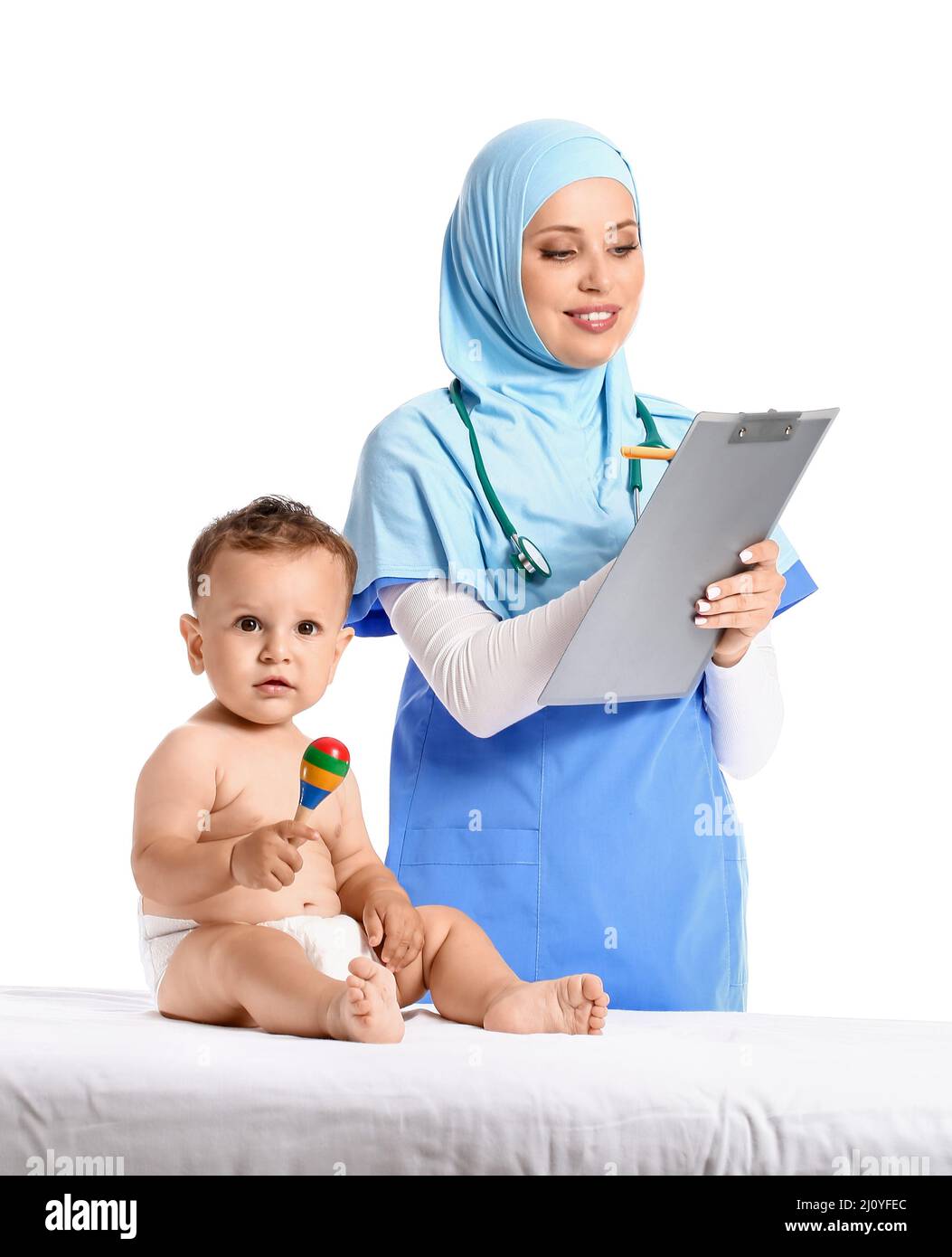 Muslim pediatrician examining baby boy on white background Stock Photo ...