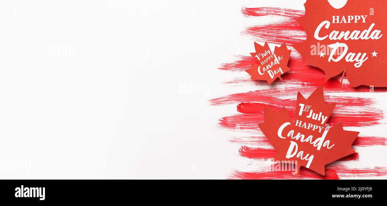 Paper maple leaves with text HAPPY CANADA DAY on white background Stock ...