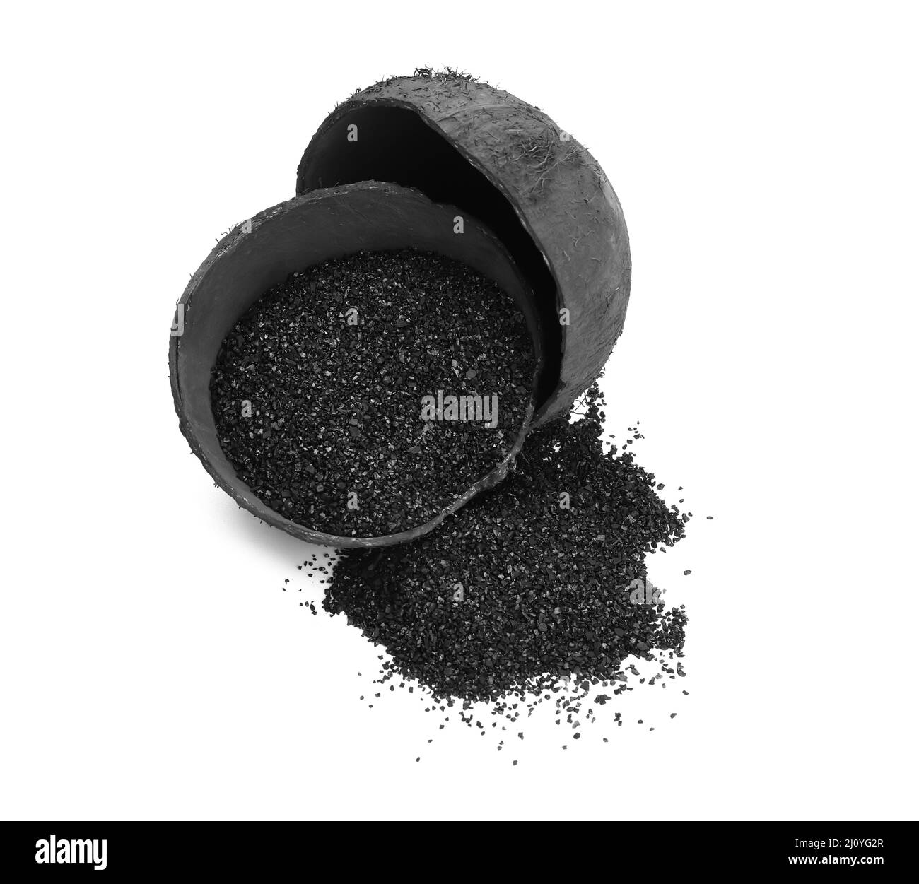 Coconut shells with activated carbon on white background Stock Photo ...