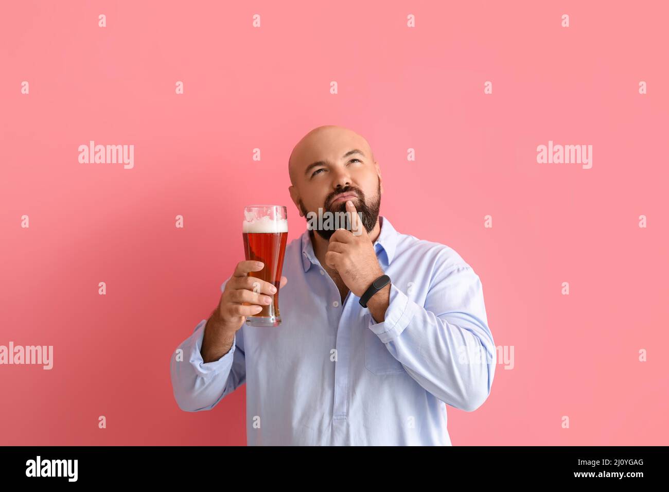 Thoughtful bald man hi-res stock photography and images - Alamy