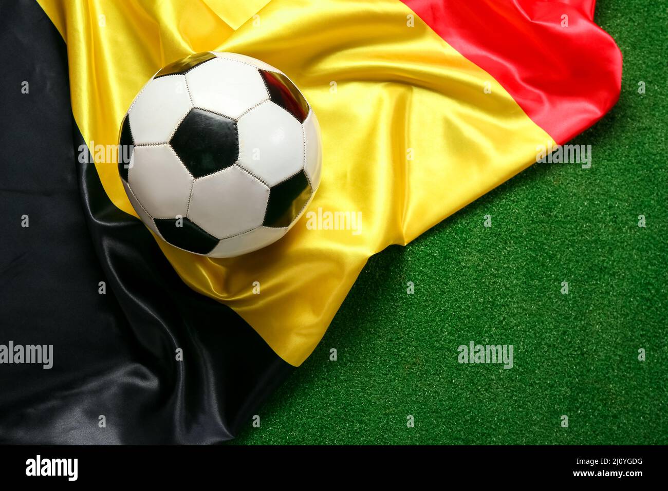 Soccer ball with Belgian flag on color background Stock Photo - Alamy