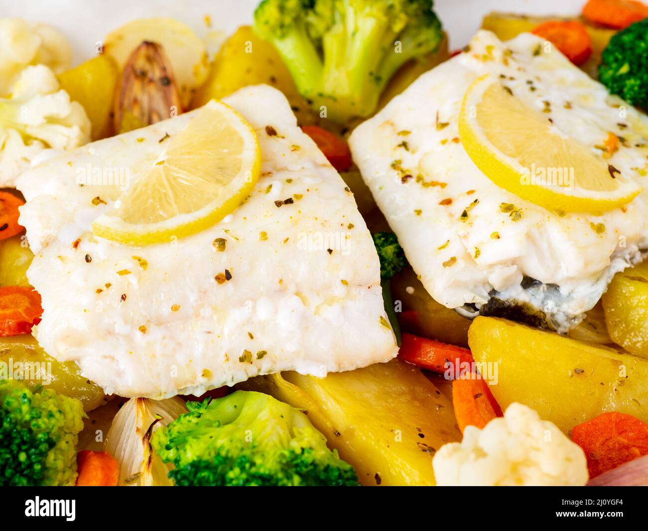 Fish cod baked with vegetables - healthy diet healthy food. Light white ...