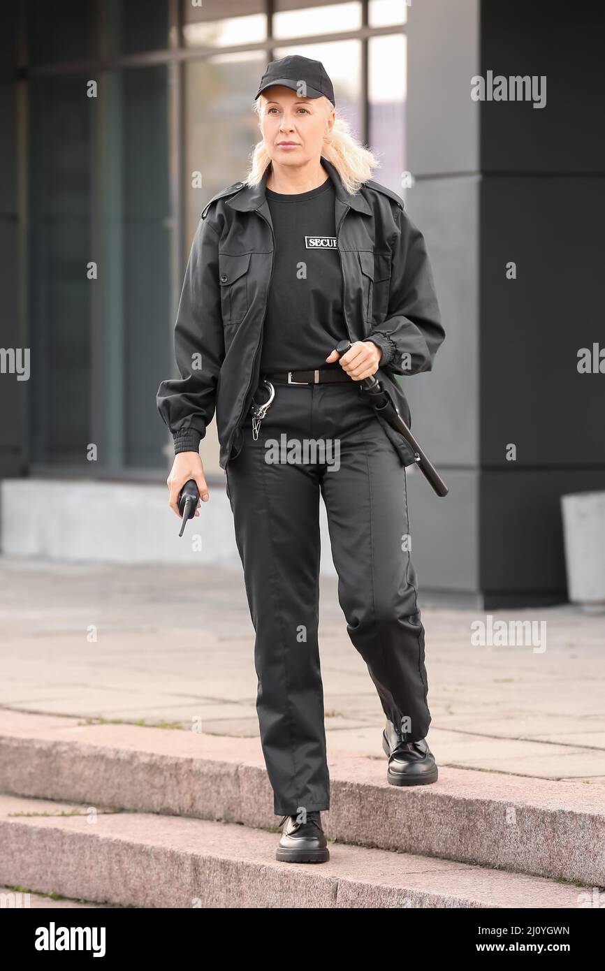 Female security guard outdoors Stock Photo - Alamy