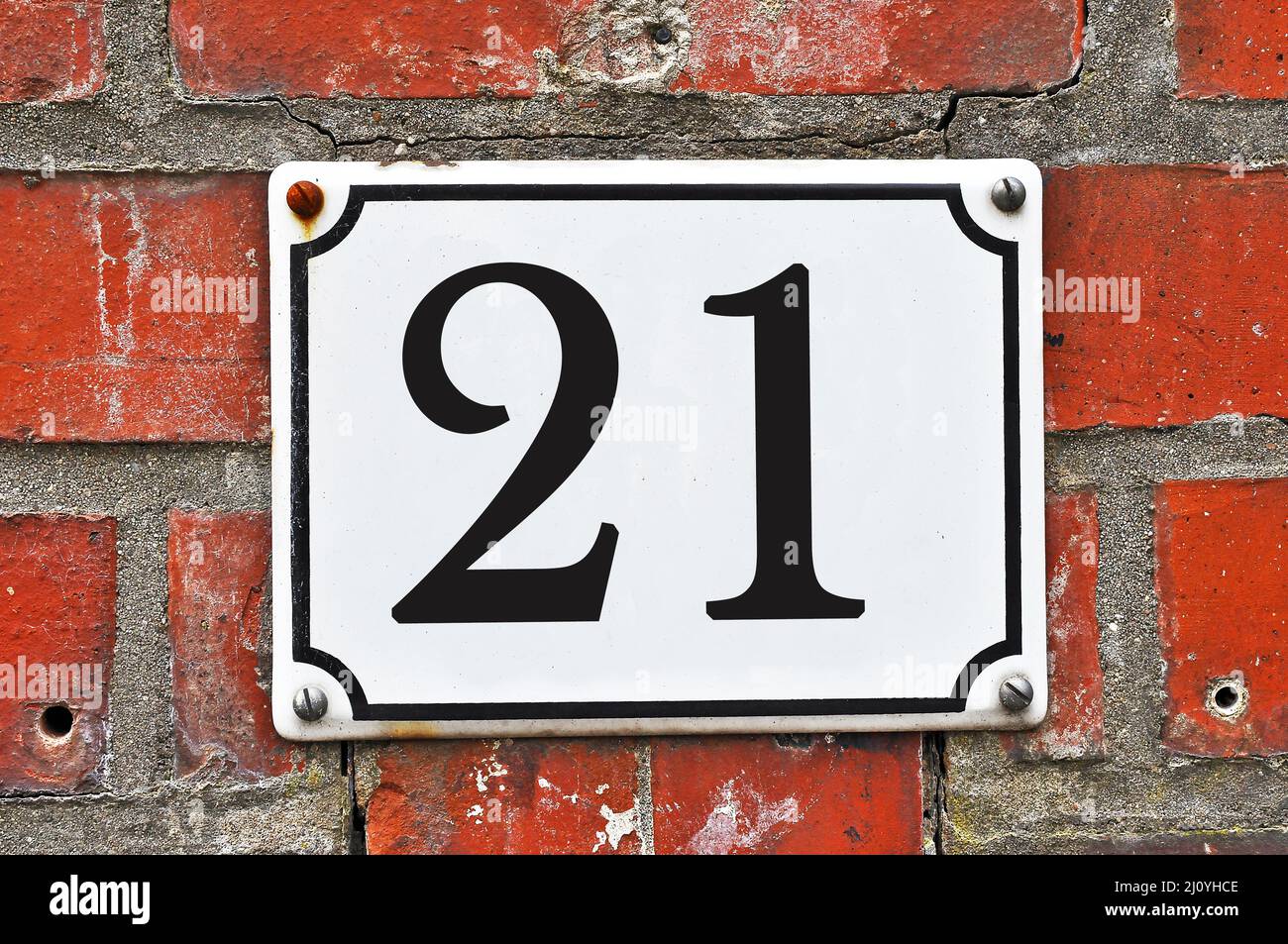 White house number plaque, showing the number twenty one Stock Photo ...