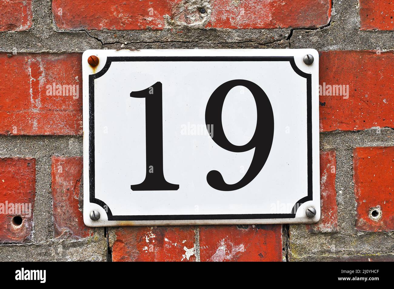 White house number plaque, showing the number nineteen Stock Photo - Alamy