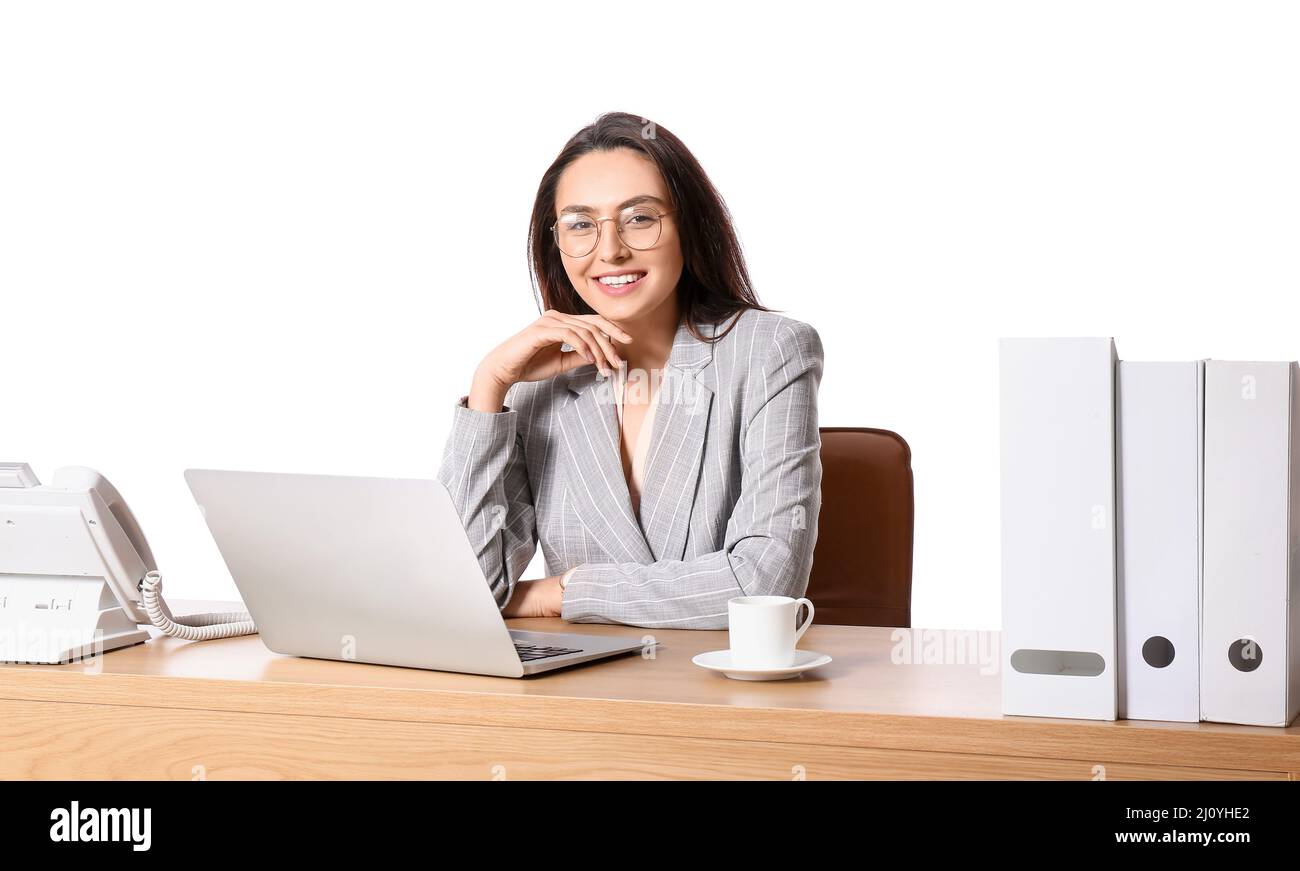 Young secretary with laptop at table on white background Stock Photo ...