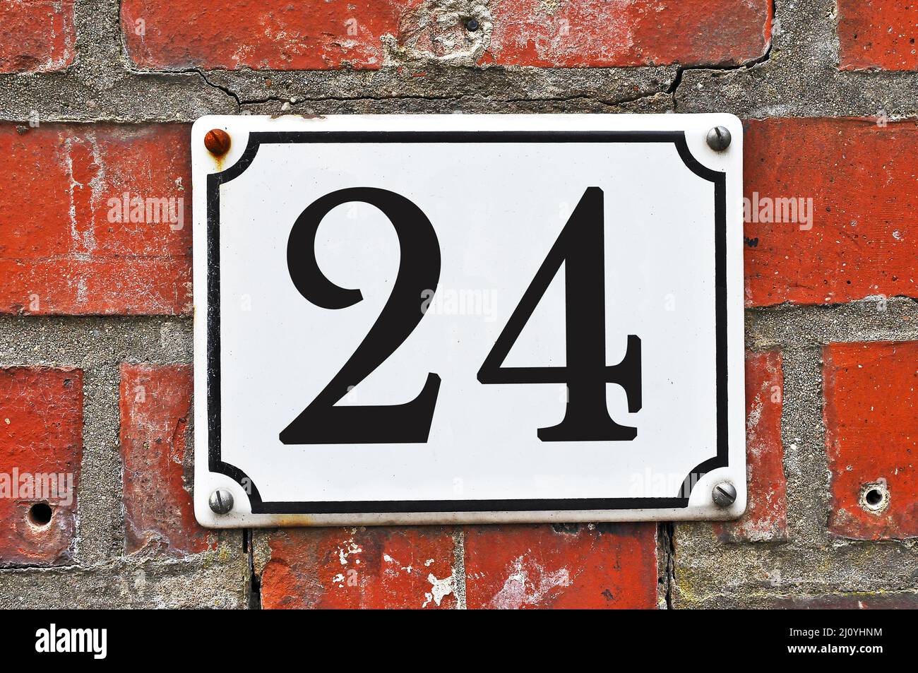 White house number plaque, showing the number twenty four Stock Photo ...