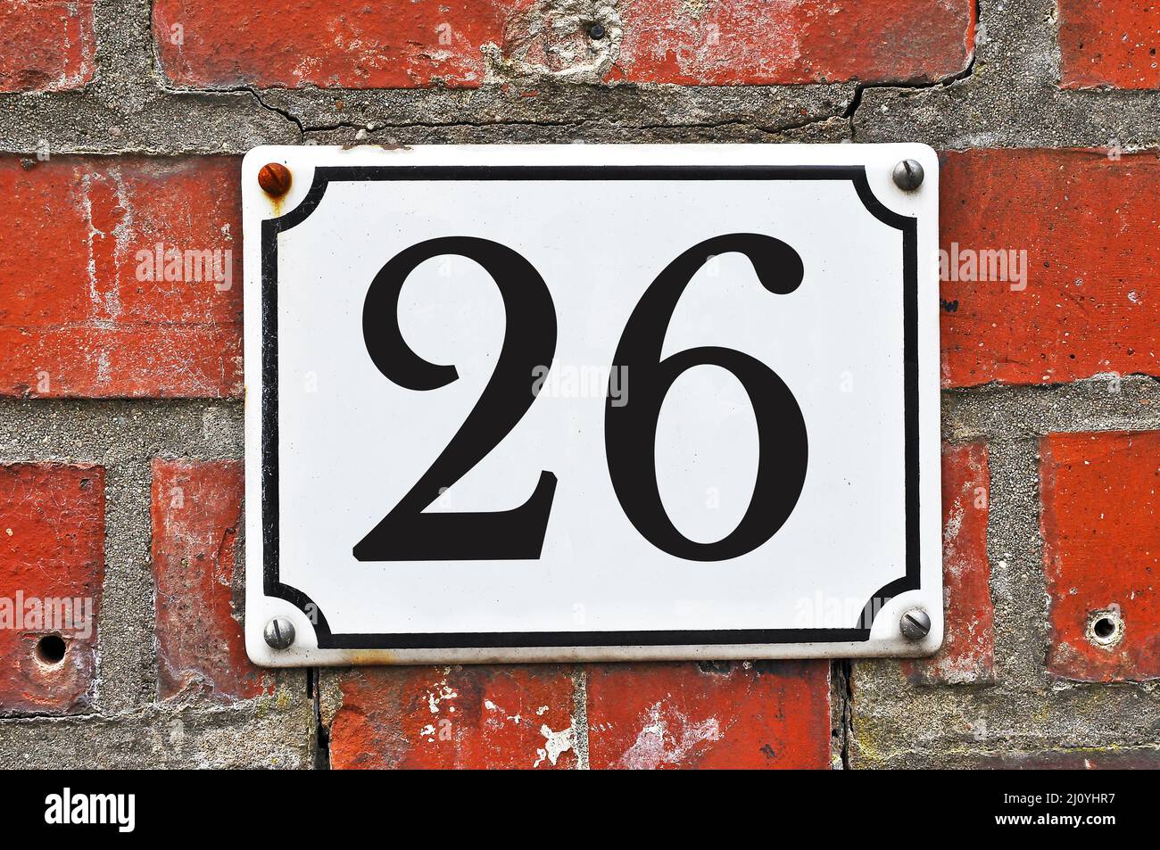 White house number plaque, showing the number twenty six Stock Photo ...