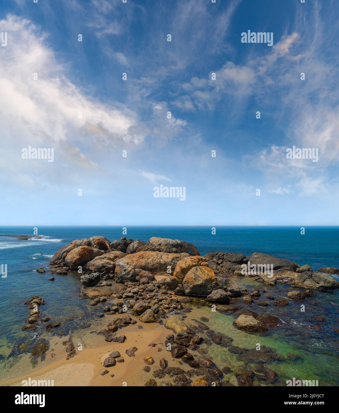 Large rocks in the ocean near the shore Stock Photo - Alamy