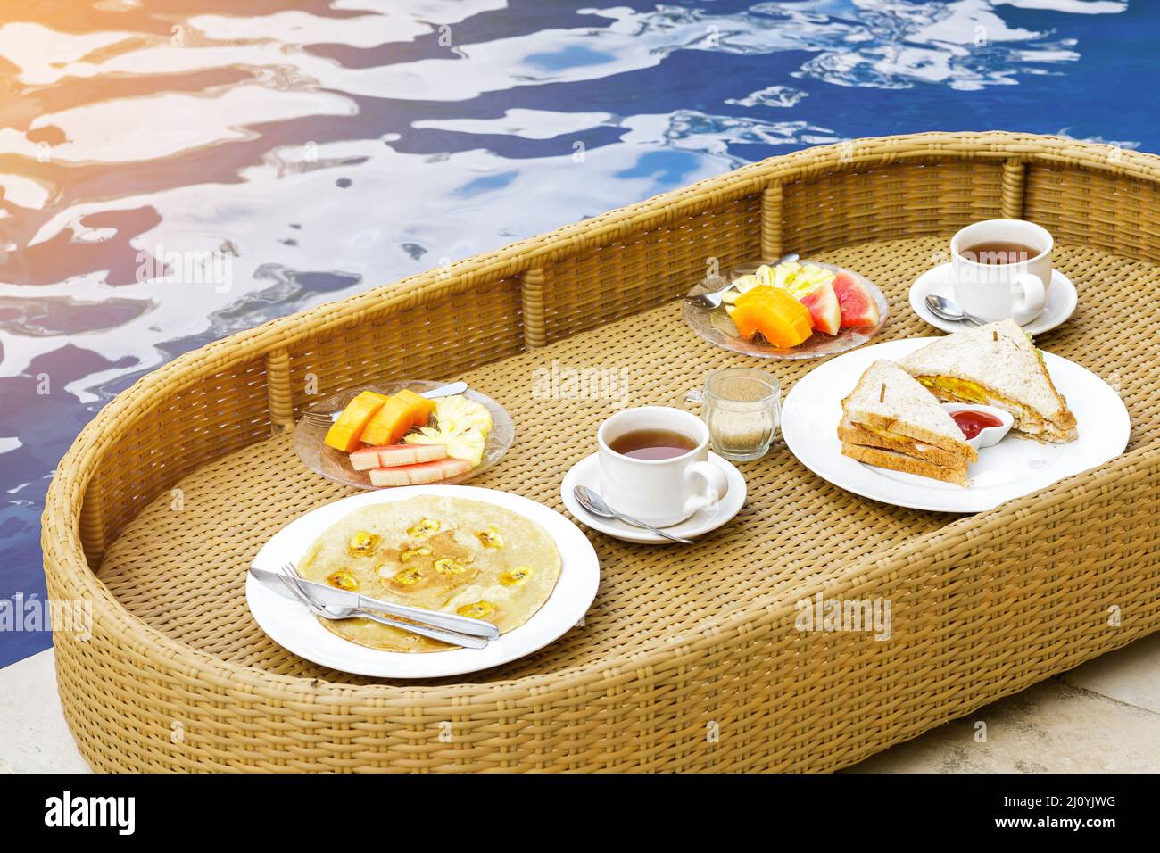 Delicious floating breakfast in the swimming pool Stock Photo - Alamy