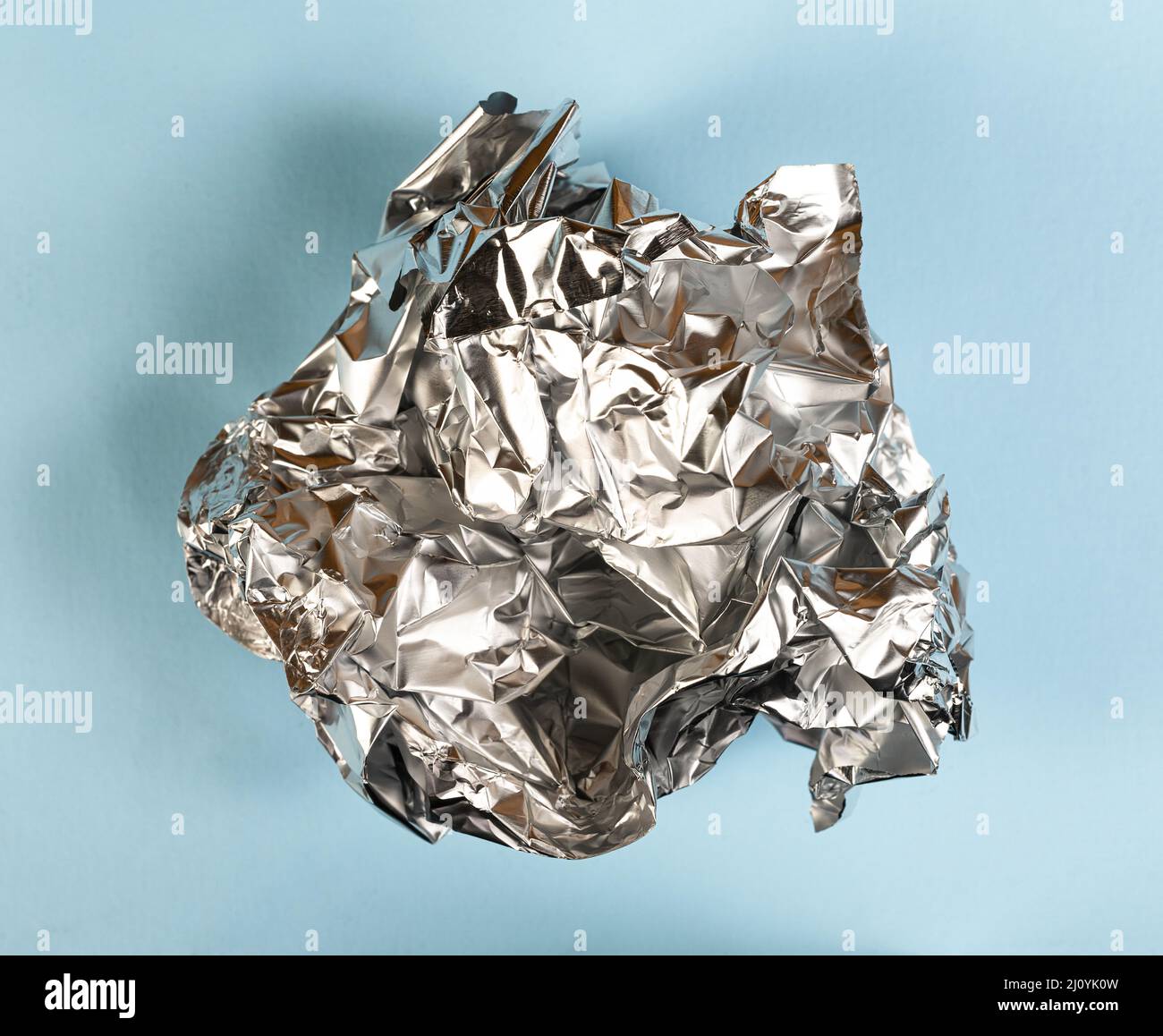 the tinfoil crumpled onto a colored surface Stock Photo - Alamy