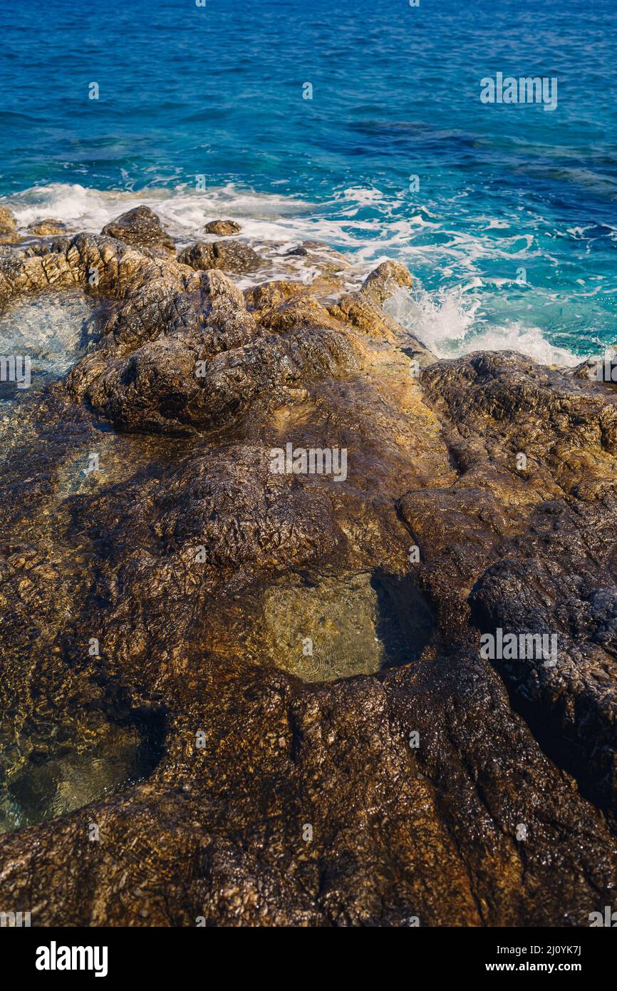 Wonderful views of the blue Mediterranean Sea. Sunny rocks, waves with ...