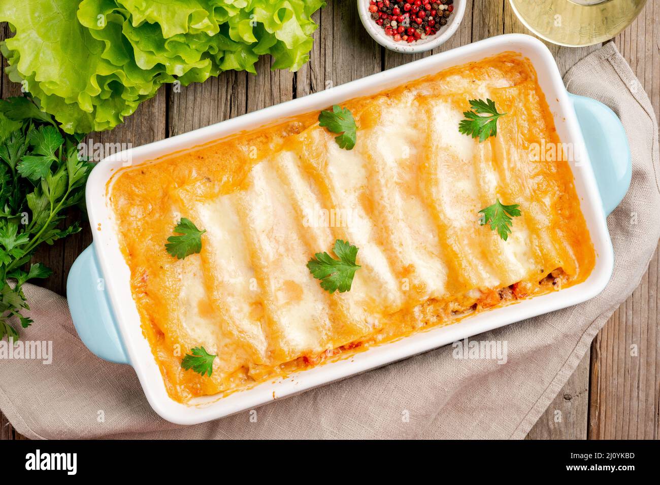 Cannelloni with filling of ground beef, tomatoes, baked with bechamel ...