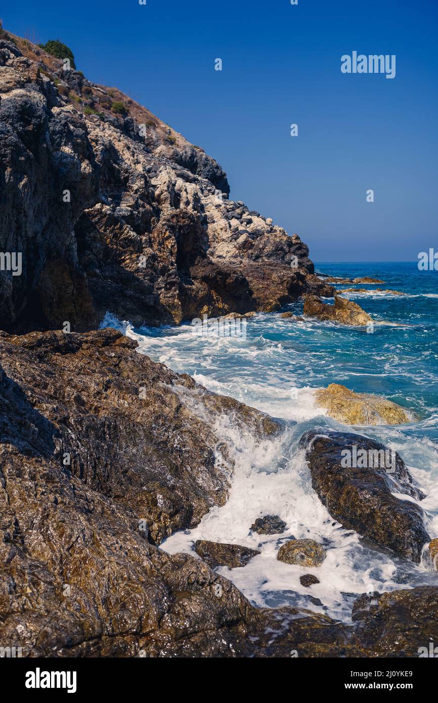Wonderful views of the blue Mediterranean Sea. Sunny rocks, waves with ...