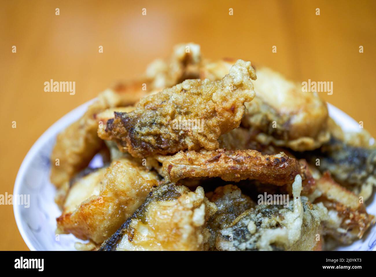 A plate of golden and tempting fried fish nuggets Stock Photo - Alamy