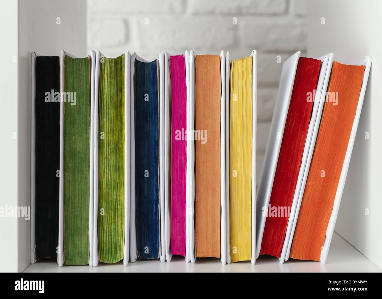 Colorful books shelf arrangement. High quality photo Stock Photo - Alamy