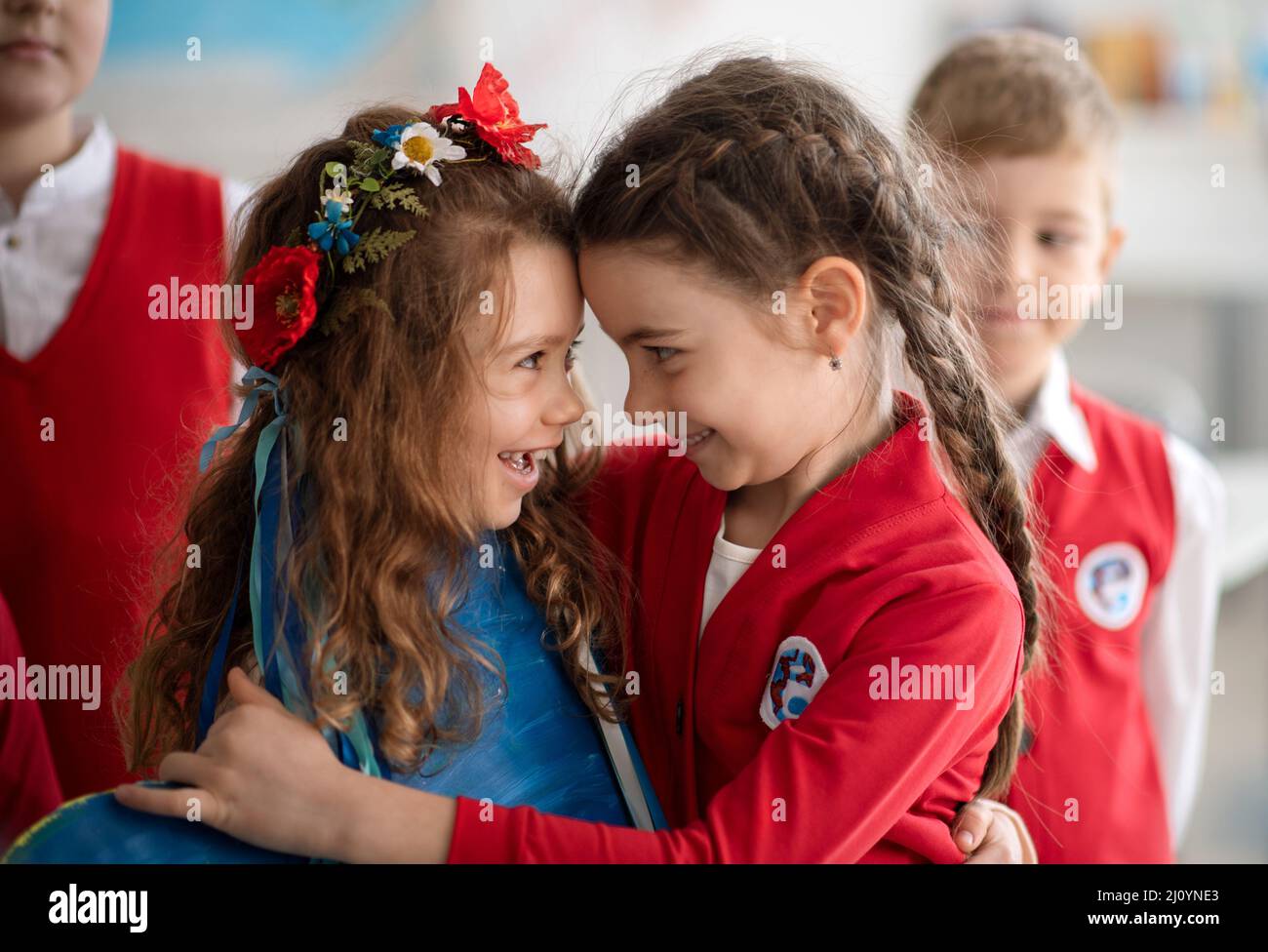 Schoolchildren welcoming new Ukrainian classmate, concept of enrolling ...