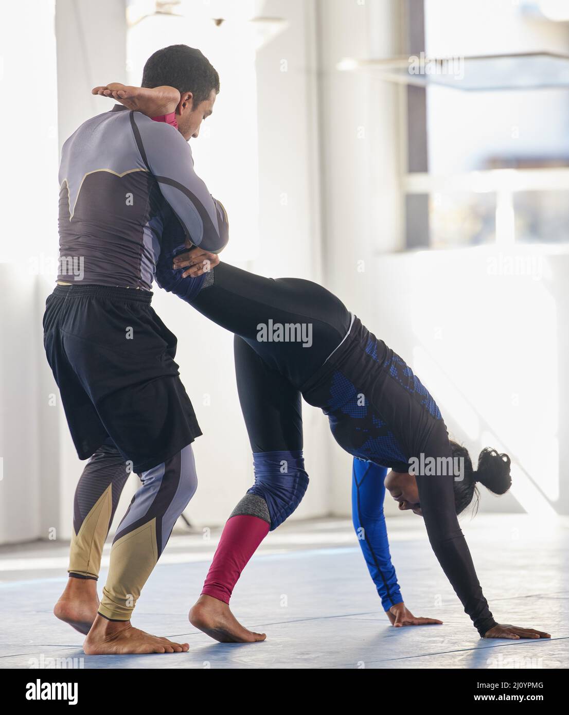 Hes a hands-on type of sensei. Full length shot of a jiu jitsu sensei ...