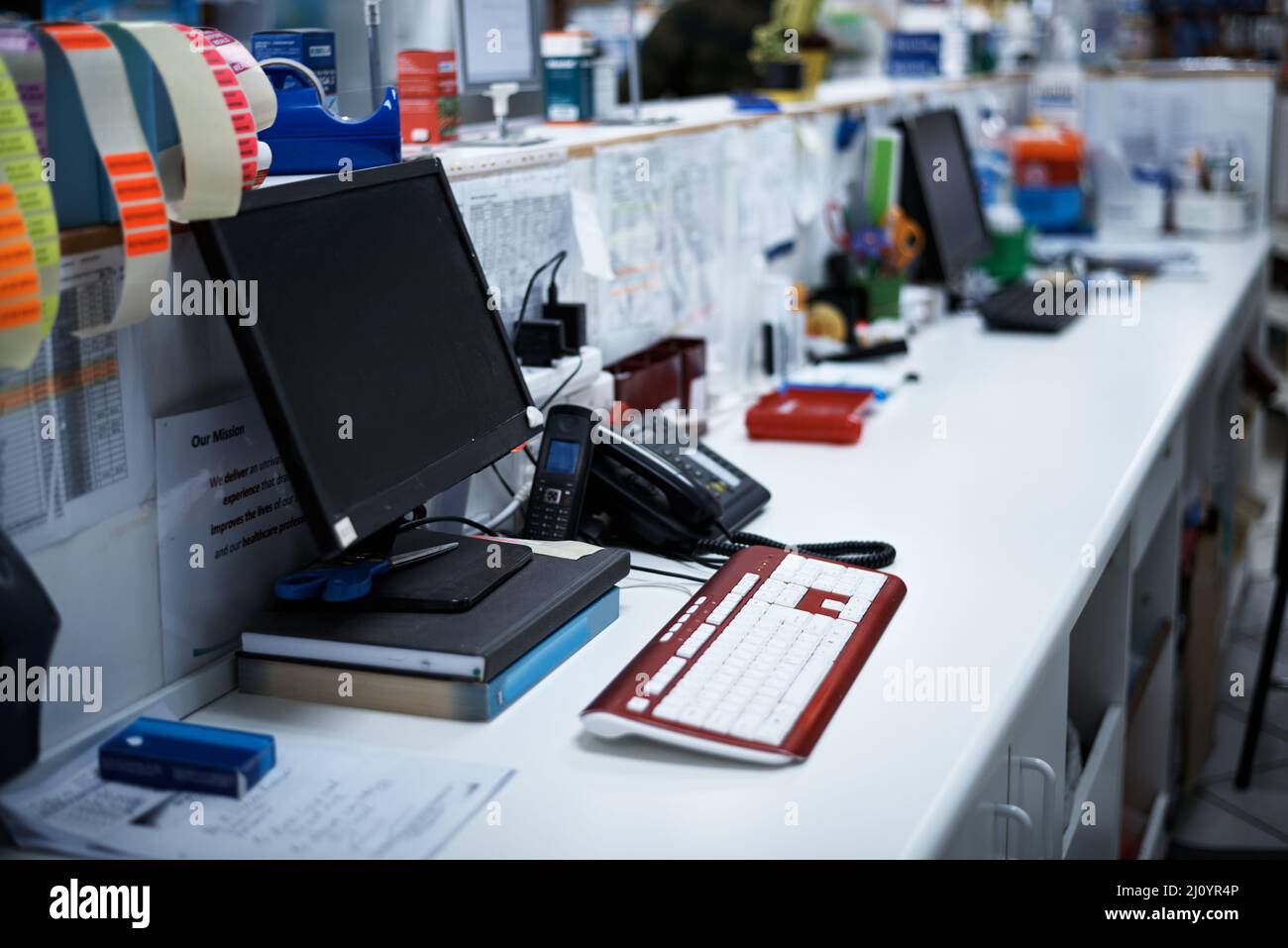 Next customer please. Shot of the teller counter in a pharmacy Stock ...