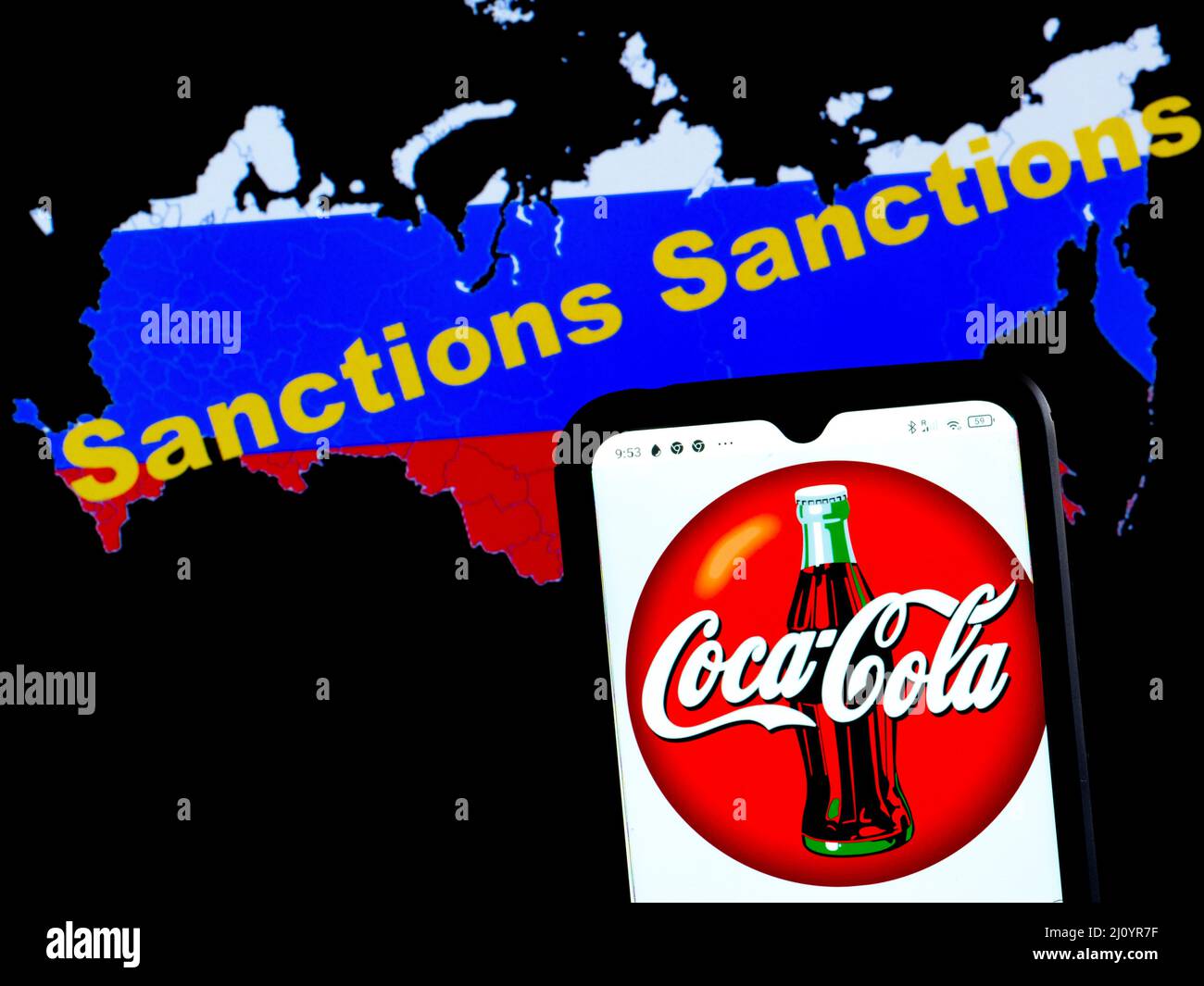 In this photo illustration, the Coca-Cola logo is displayed on a ...