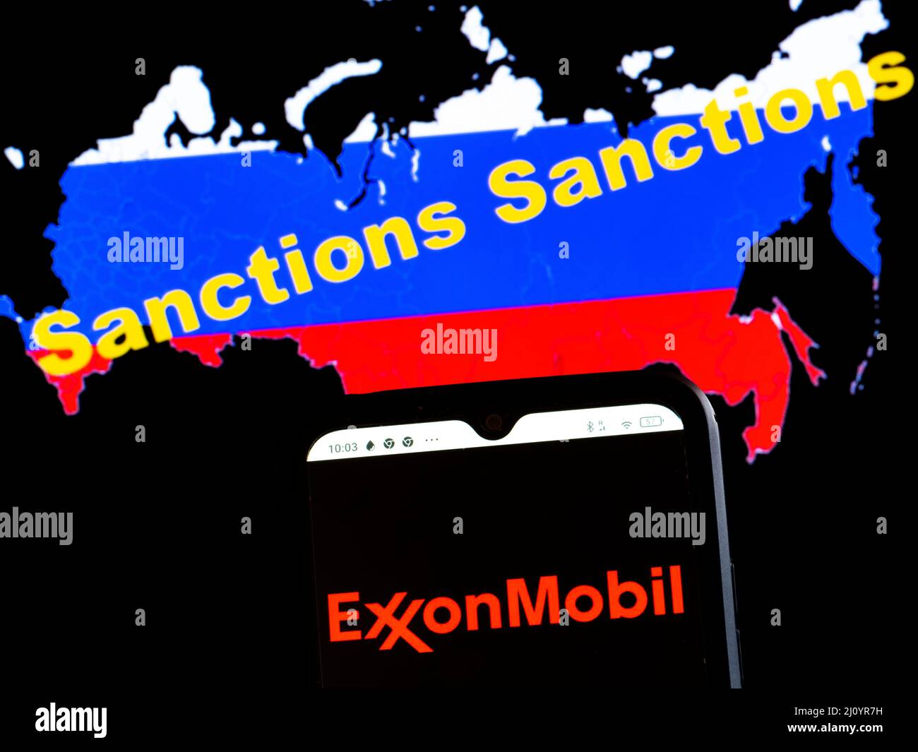 In this photo illustration, the Exxon Mobill logo is displayed on a ...