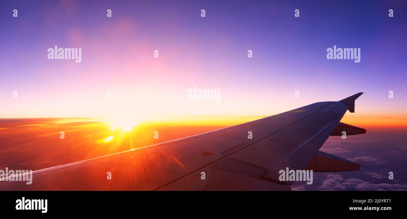 Sunset view airplane window Stock Photo - Alamy