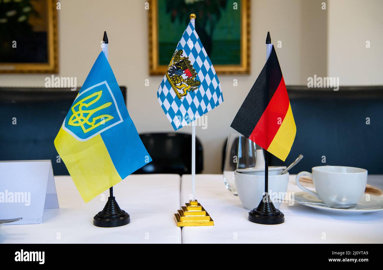 Munich, Germany. 21st Mar, 2022. The flags of Ukraine, Bavaria and ...