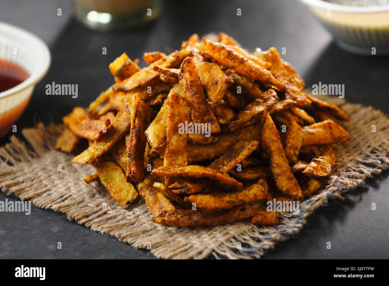 Crispy Fried Potato Chips with hot tea and sauce Stock Photo - Alamy