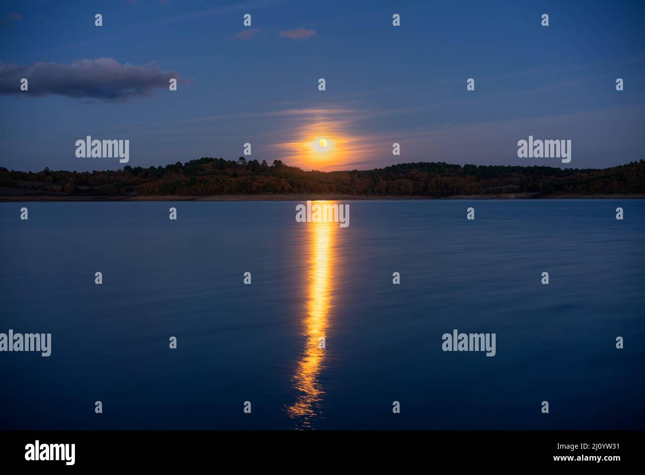 Full moon reflection on a lake at night in Sabugal Dam, Portugal Stock ...