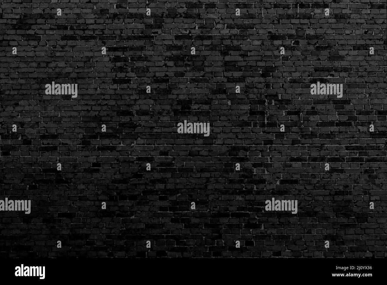 Black brick building wall. Interior of a modern loft. Background for ...