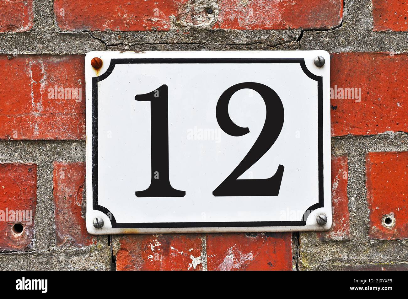 White house number plaque, showing the number twelve Stock Photo - Alamy