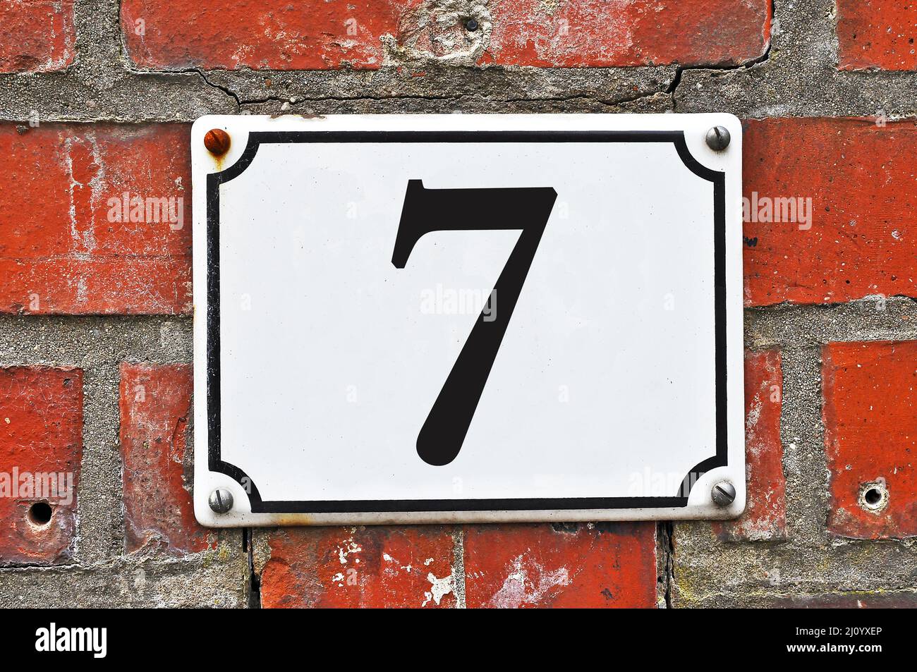 White house number plaque, showing the number seven Stock Photo - Alamy