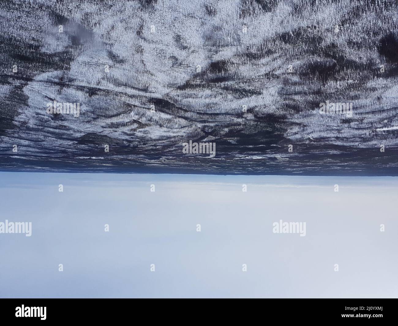 Aerial view of the landscape with forest covered in snow Stock Photo ...