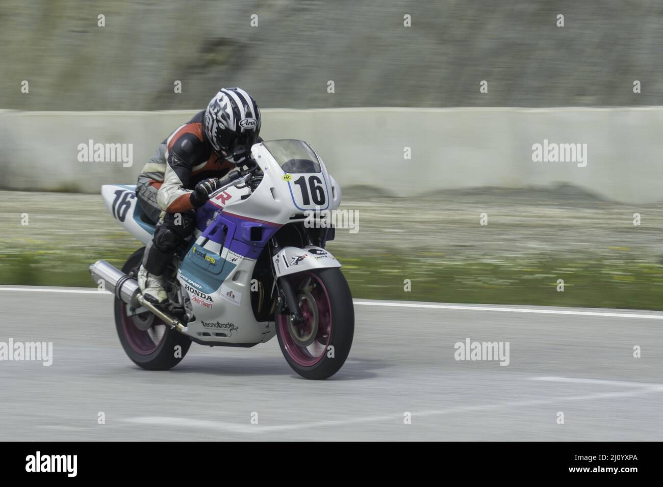 Classic racing sport motorbike running in the asphalt track Stock Photo ...