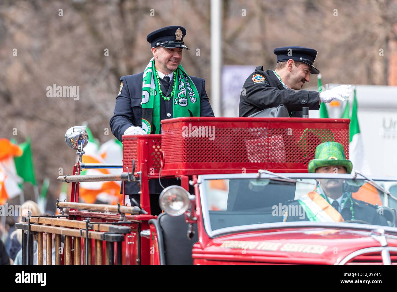 Officers of the fire department in a vintage fire truck or engine ...