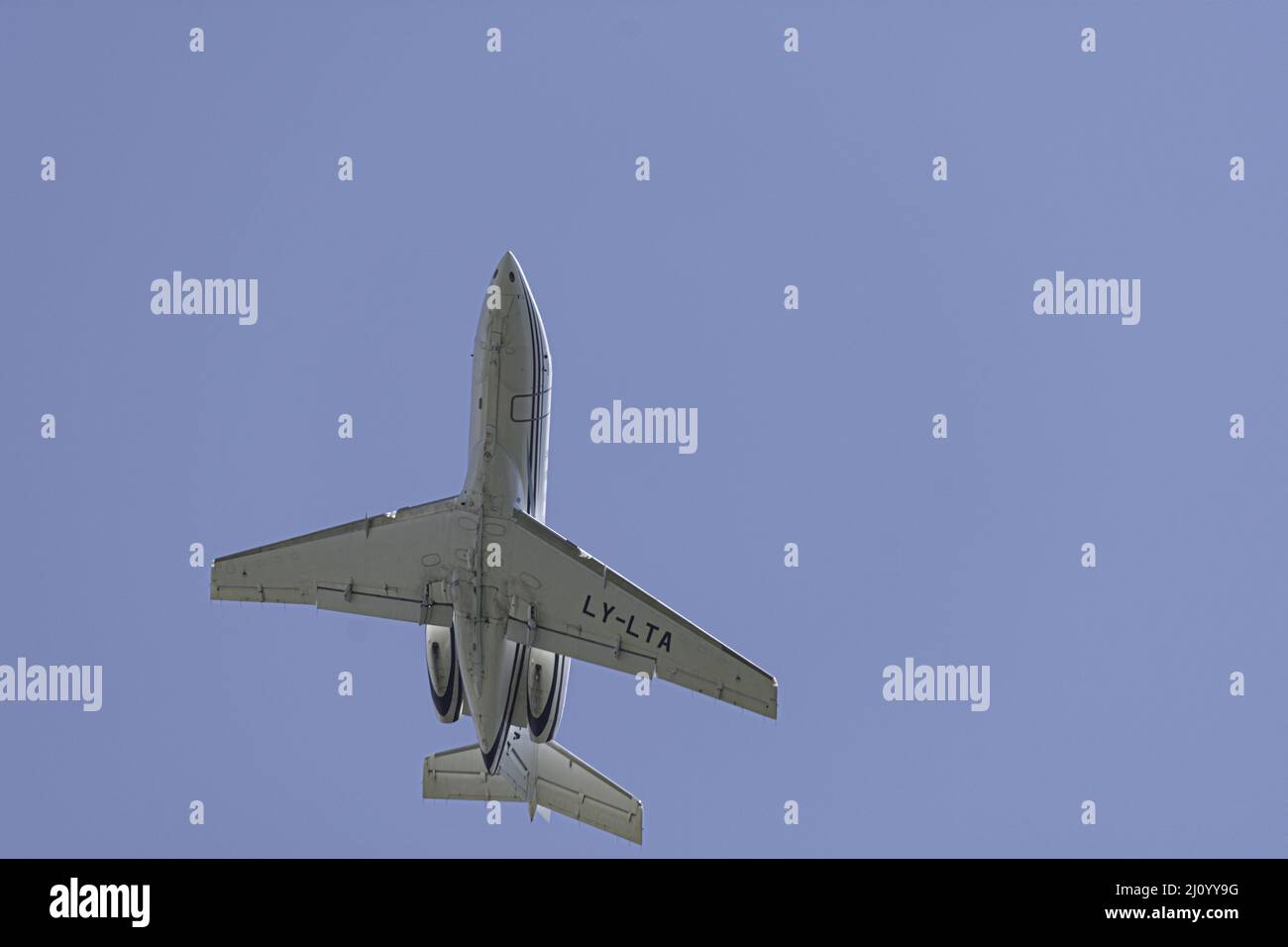 Little private jet airplane in the sky Stock Photo - Alamy