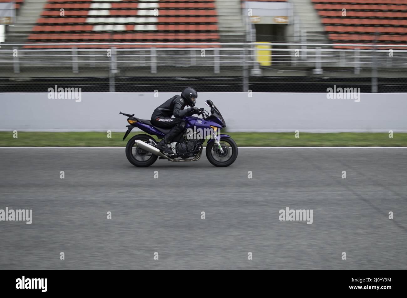 Classic racing sport motorbike running in the asphalt track Stock Photo ...