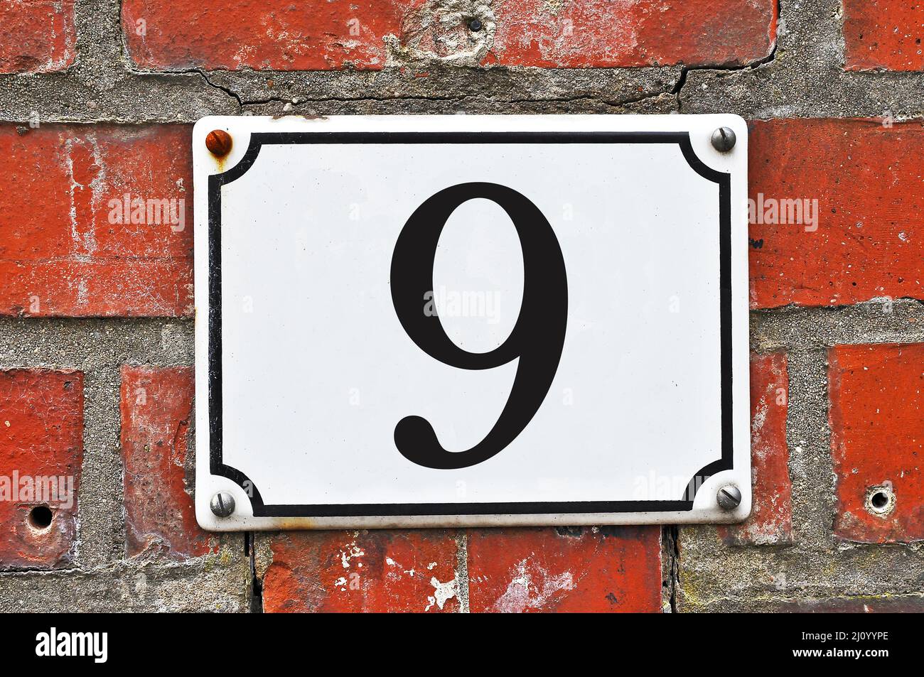 White house number plaque, showing the number nine Stock Photo - Alamy