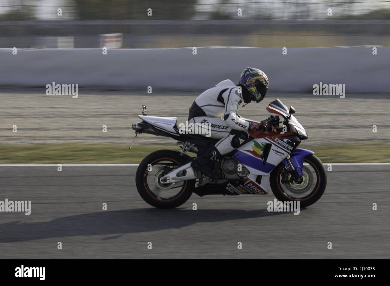 Classic racing sport motorbike running in the asphalt track Stock Photo ...