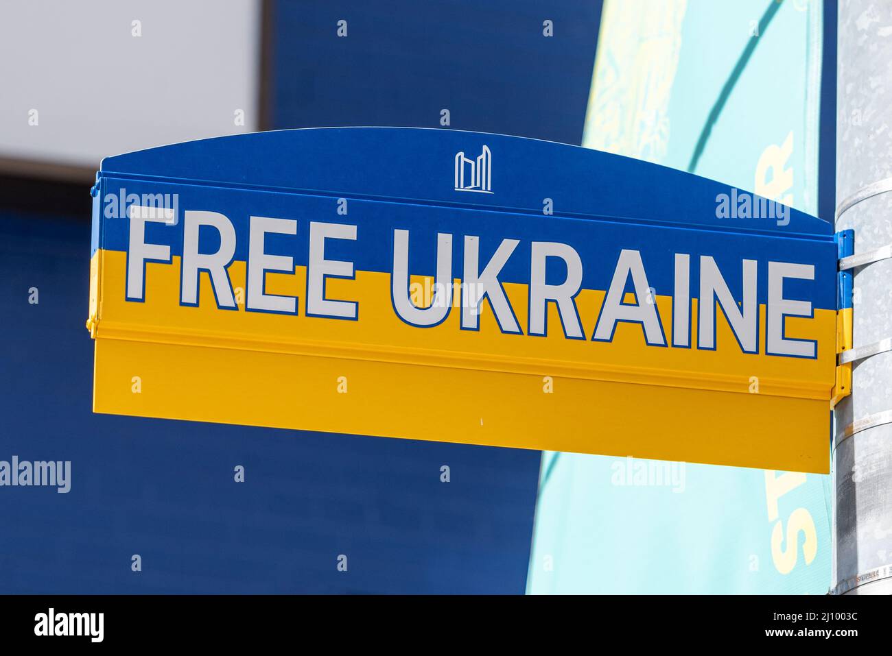 A symbolic street sign reading 'Free Ukraine' is installed in front of ...