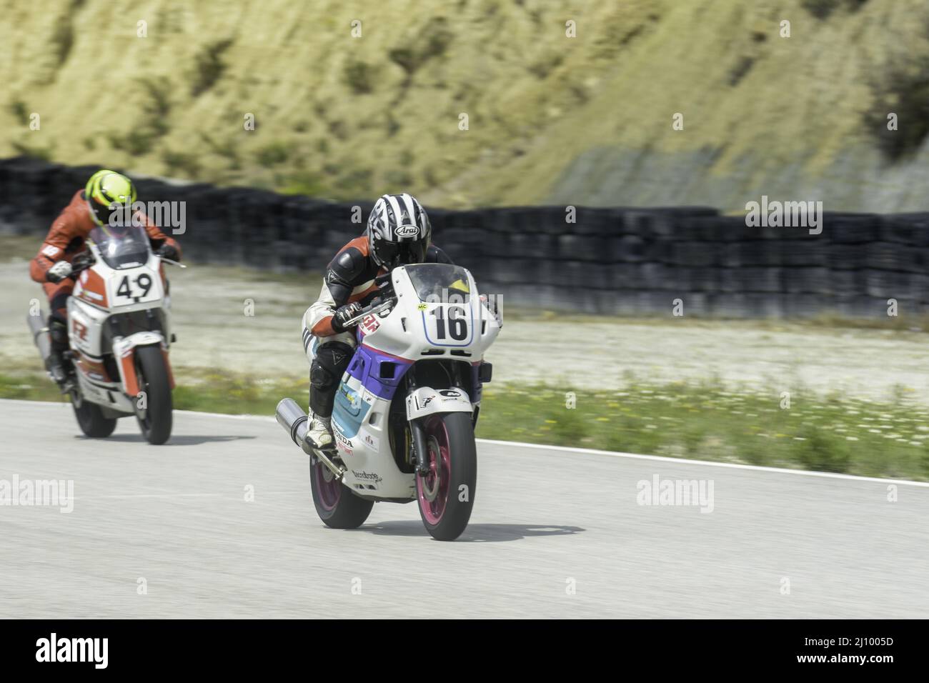 Classic racing sport motorbike running in the asphalt track Stock Photo ...