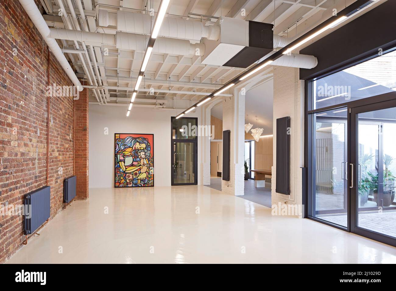 Entrance space with originally existing brick wall. Symes Mews, London ...
