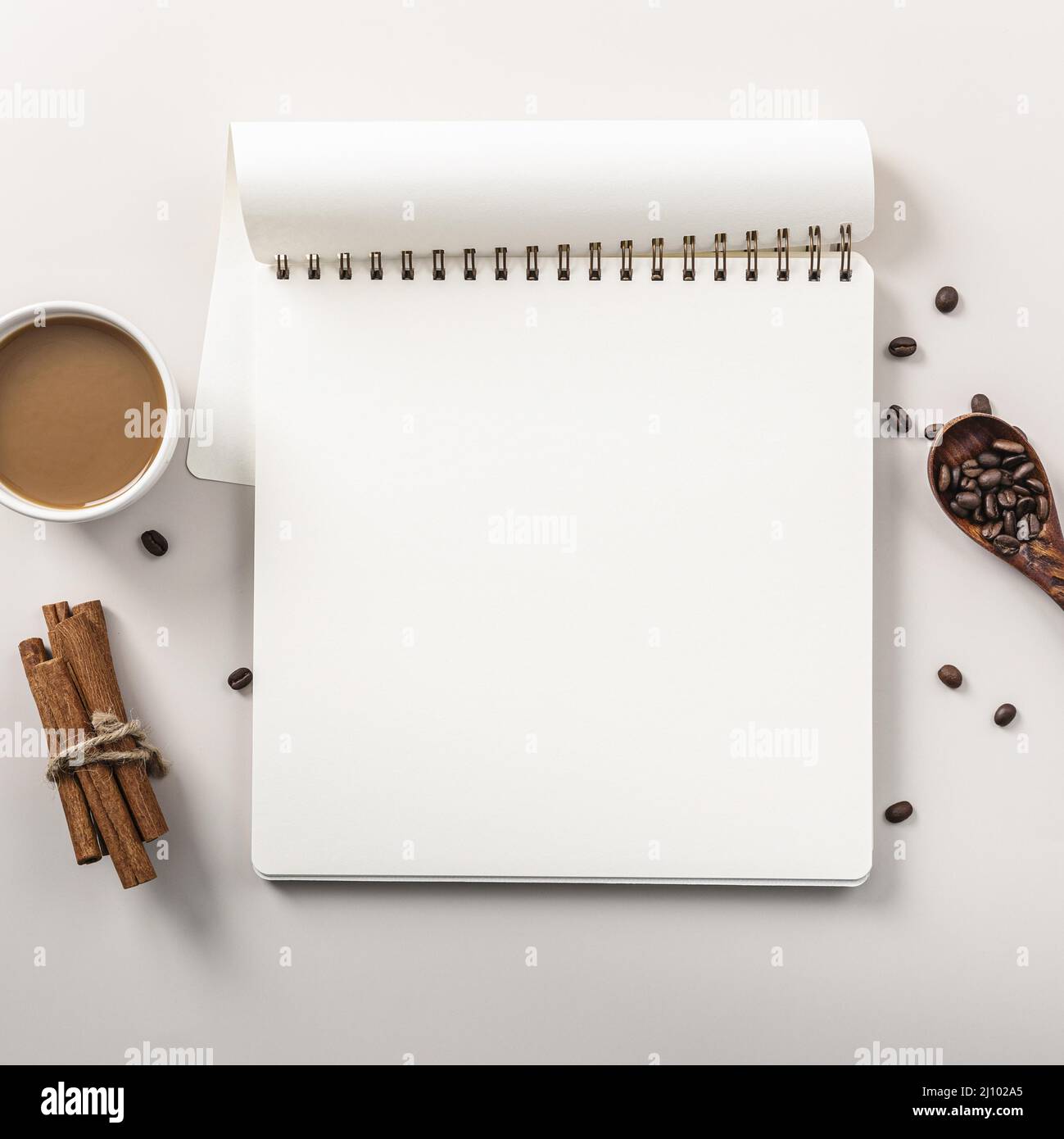 Flat lay notebook with coffee cup cinnamon sticks Stock Photo - Alamy