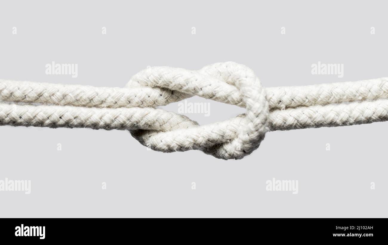 Ship white ropes knot isolated white background Stock Photo - Alamy