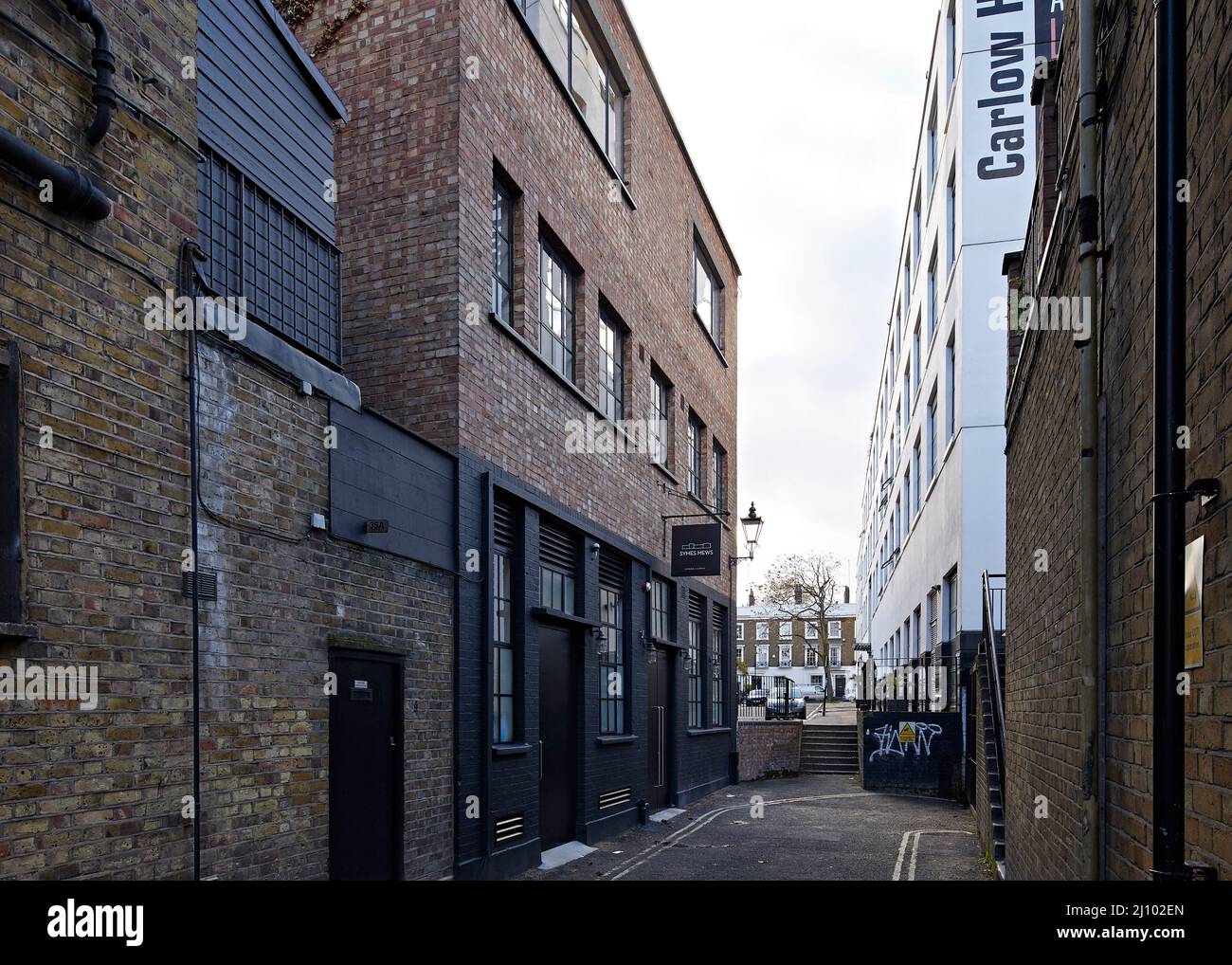 Perspective along building facade. Symes Mews, London, United Kingdom ...