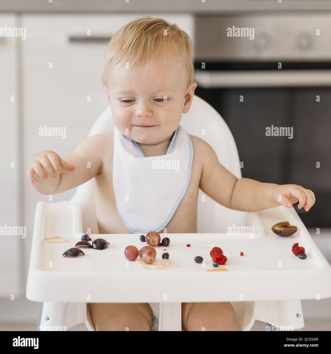 Cute baby eating hi-res stock photography and images - Alamy