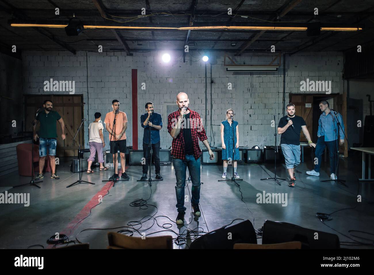 Behind the scenes. Rehearsal at theatre. Large group of actors ...