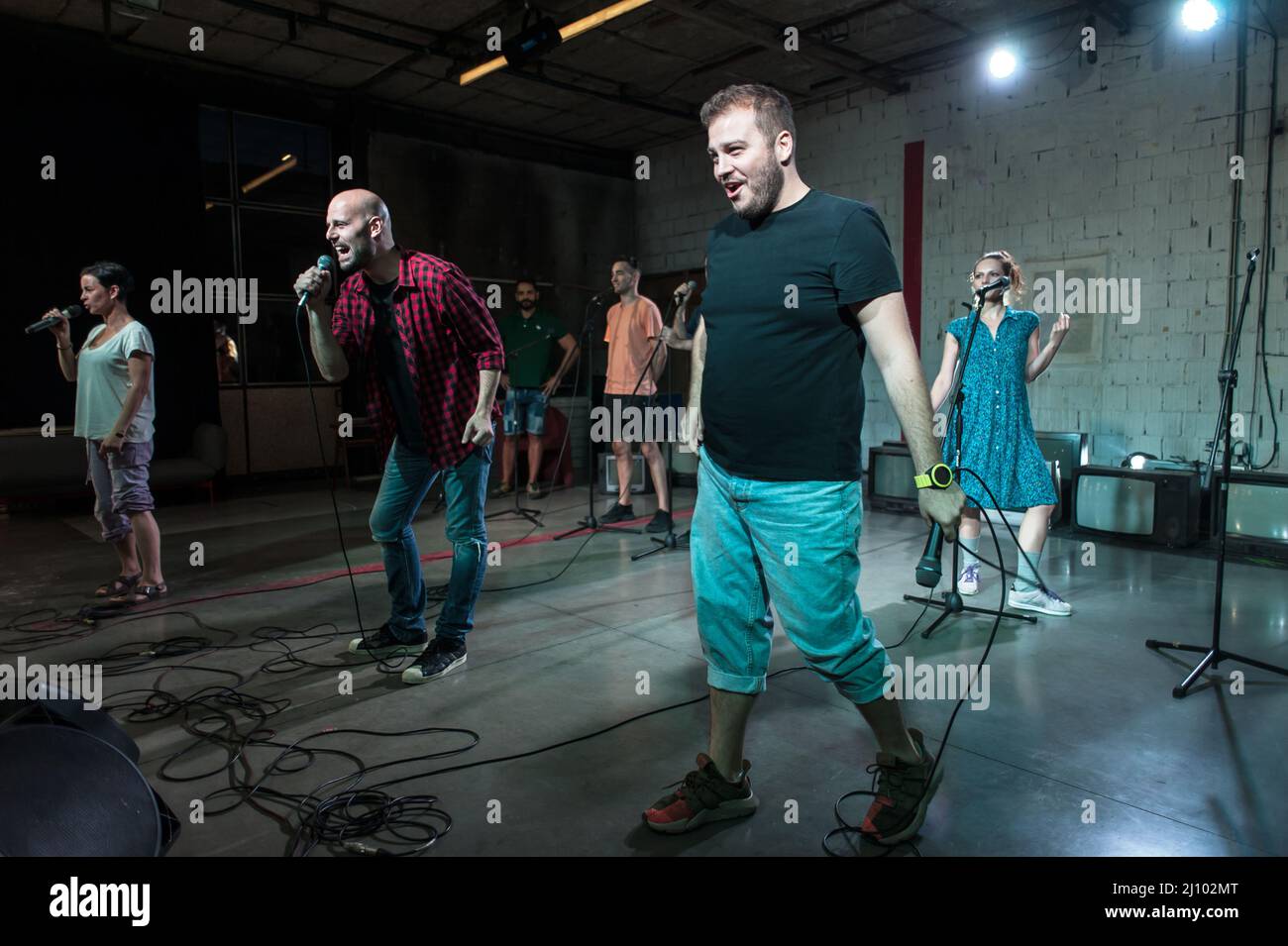 Behind the scenes. Rehearsal at theatre. Large group of actors ...