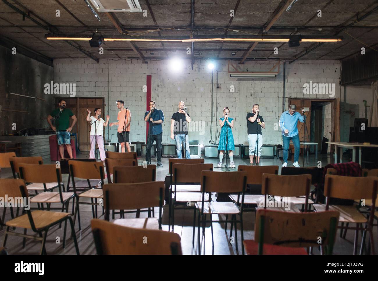 Behind the scenes. Rehearsal at theatre. Large group of actors ...