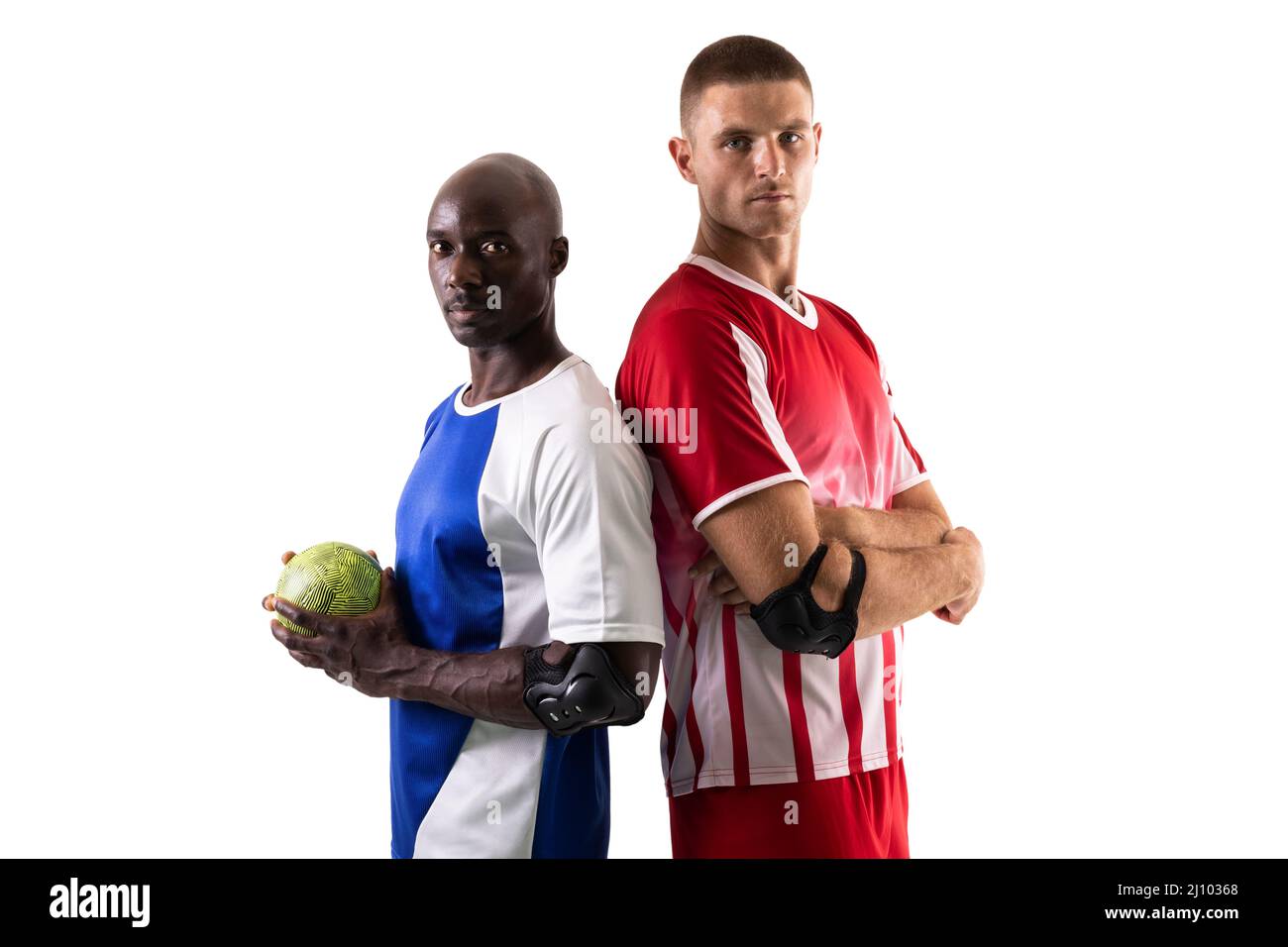 Portrait of multiracial male rival handball players standing back to ...